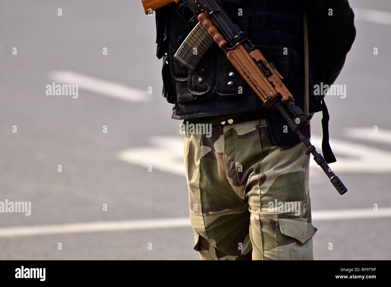 Security guard with rifle standing on outside to protect the area Stock ...