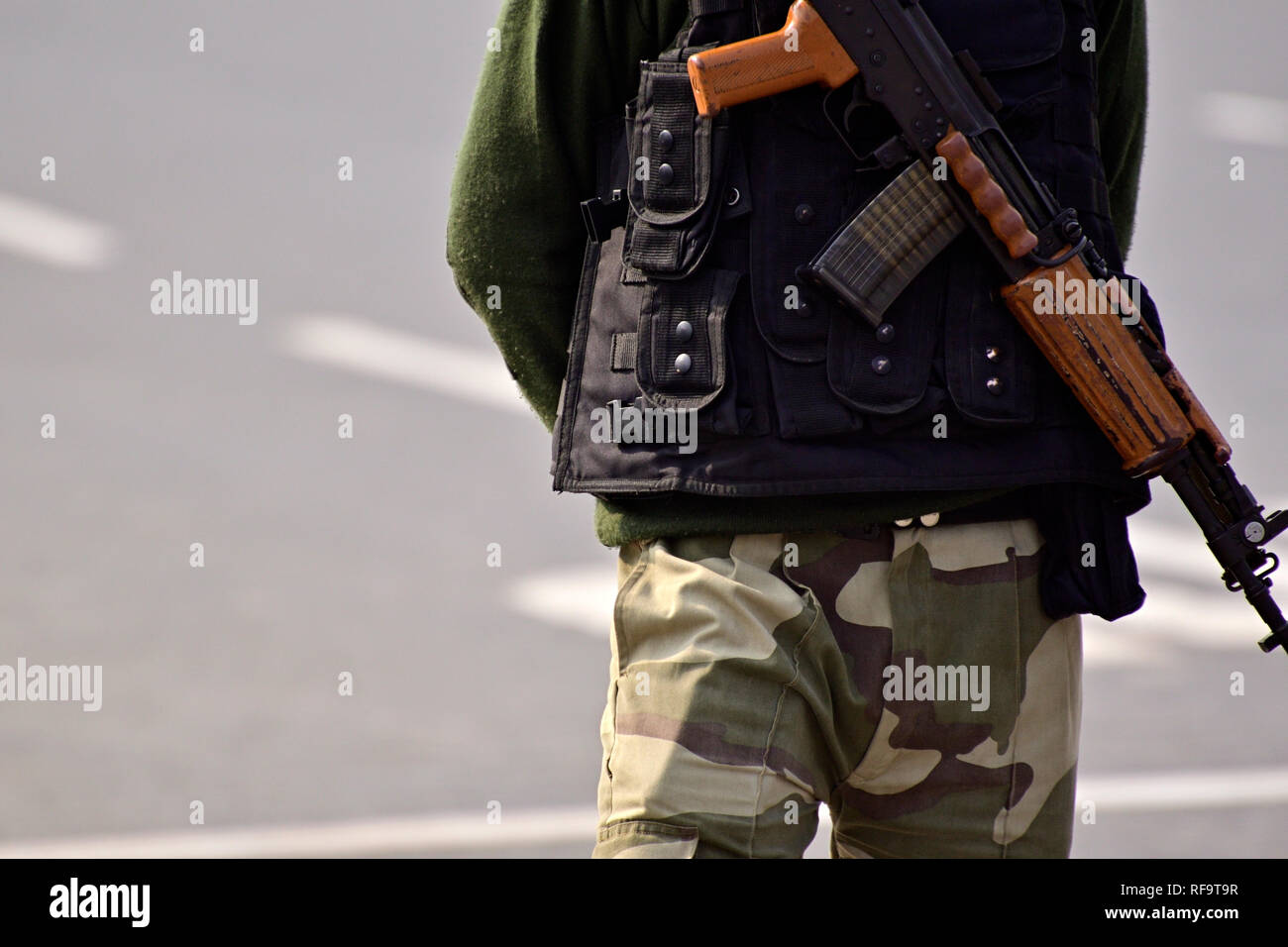 Security guard with rifle standing on outside to protect the area Stock ...