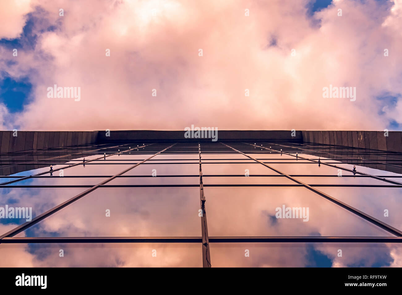 Sky reflection on a shiny glass of a building Stock Photo - Alamy