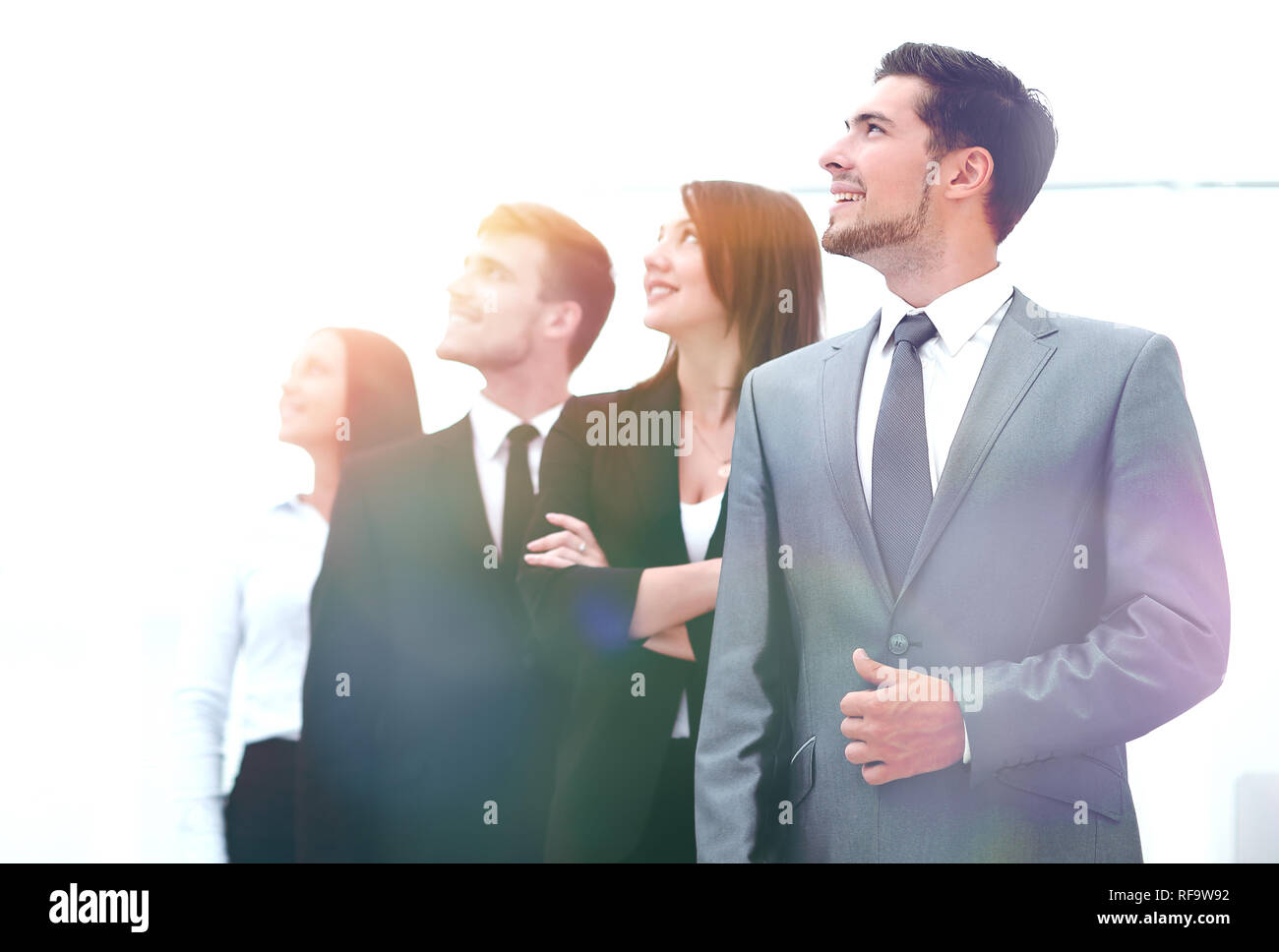 business team standing one behind the other and looking forward Stock ...