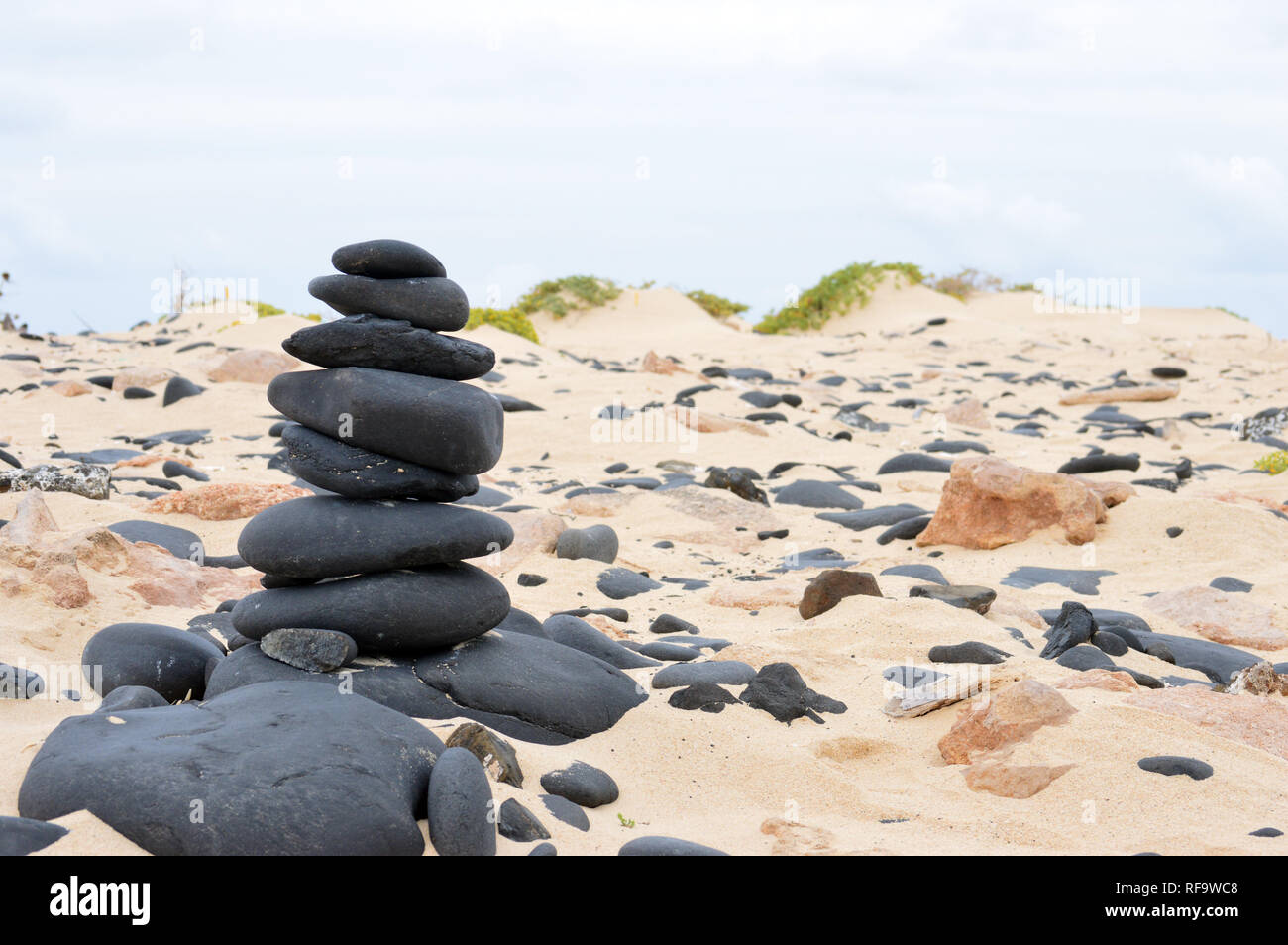 Cairn made of Black Volcanic Pebbles on a Beach on the Southern Coast ...