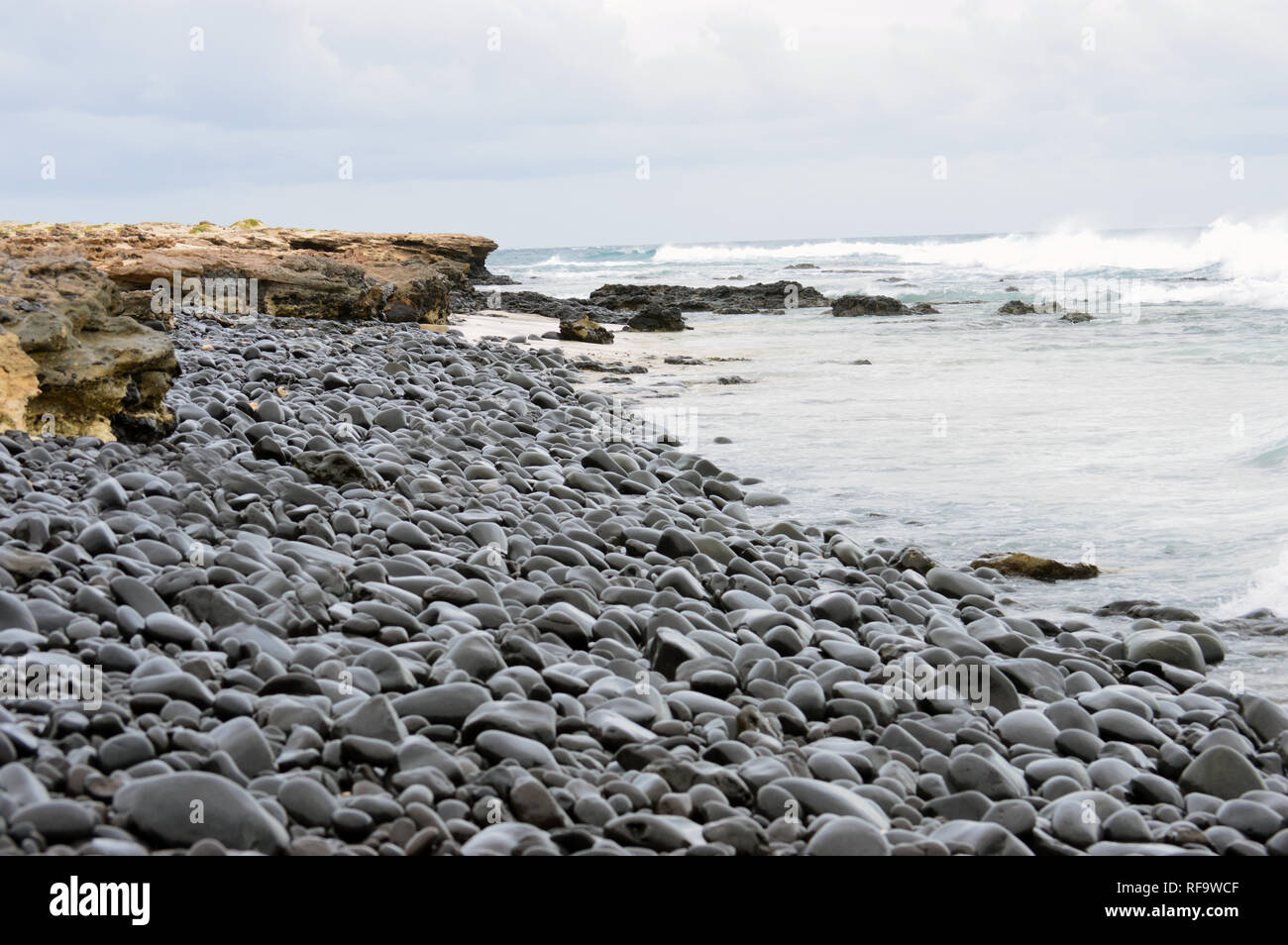Black Volcanic Pebbles on a Beach on the Southern Coast of the Island ...