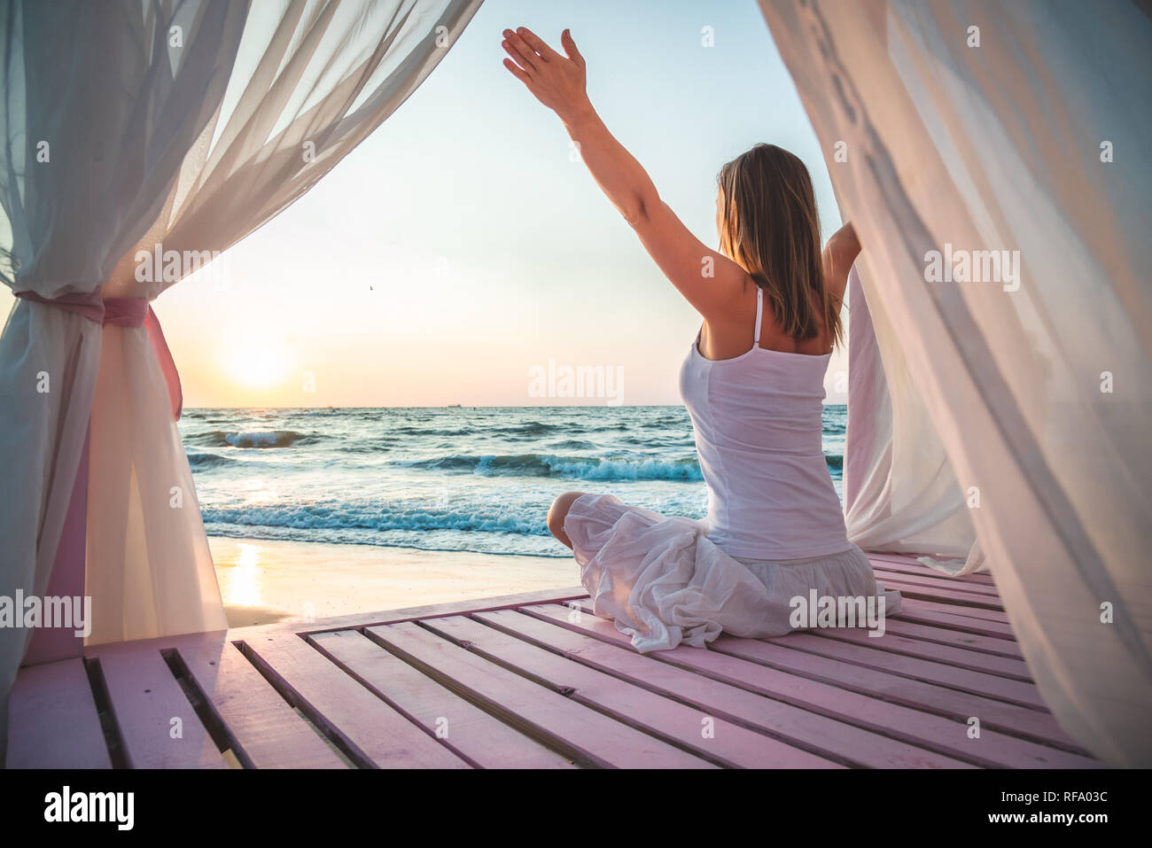 serenity and yoga practicing at the sea. sunrise Stock Photo - Alamy