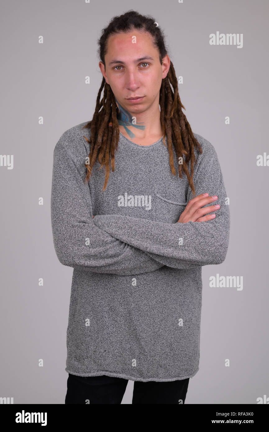 Portrait of young handsome man with dreadlocks crossing arms Stock ...