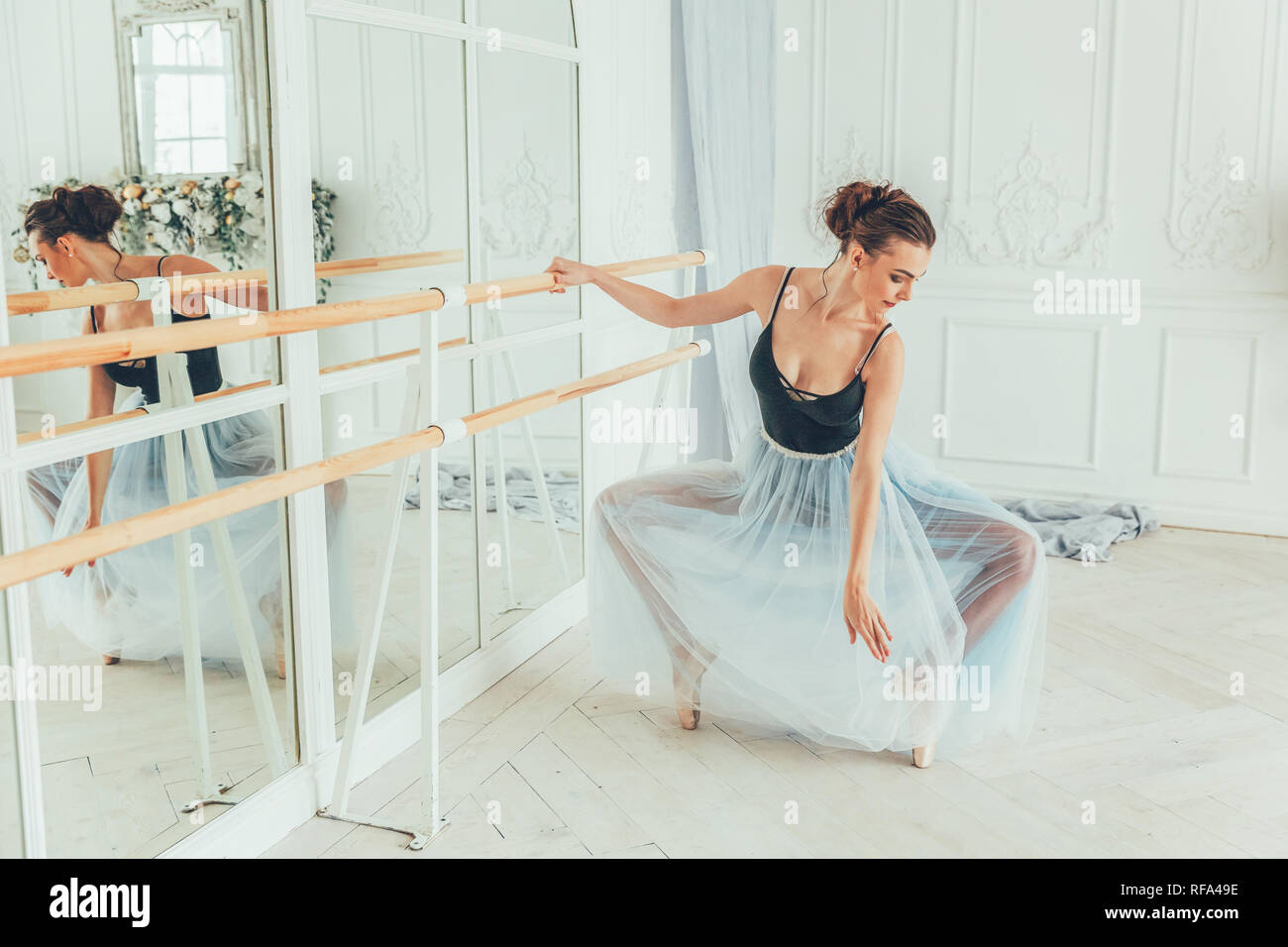 Young classical ballet dancer woman in dance class. Beautiful graceful ...