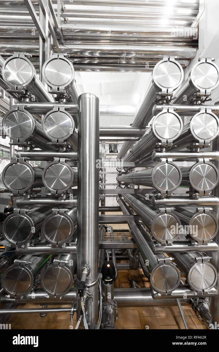 Steel pipelines and cables in factory interior as industrial zone ...