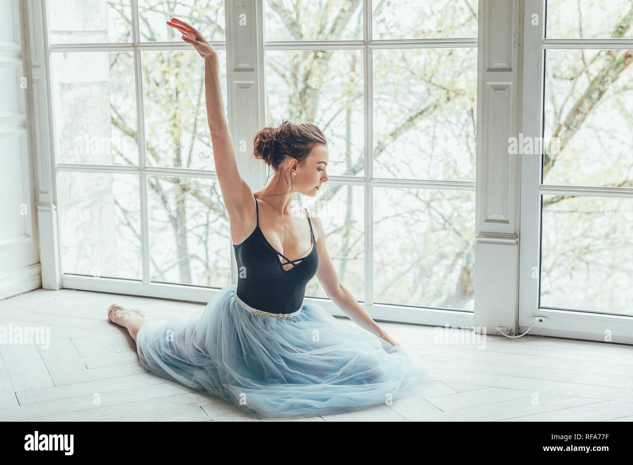Young classical ballet dancer woman in dance class. Beautiful graceful ...