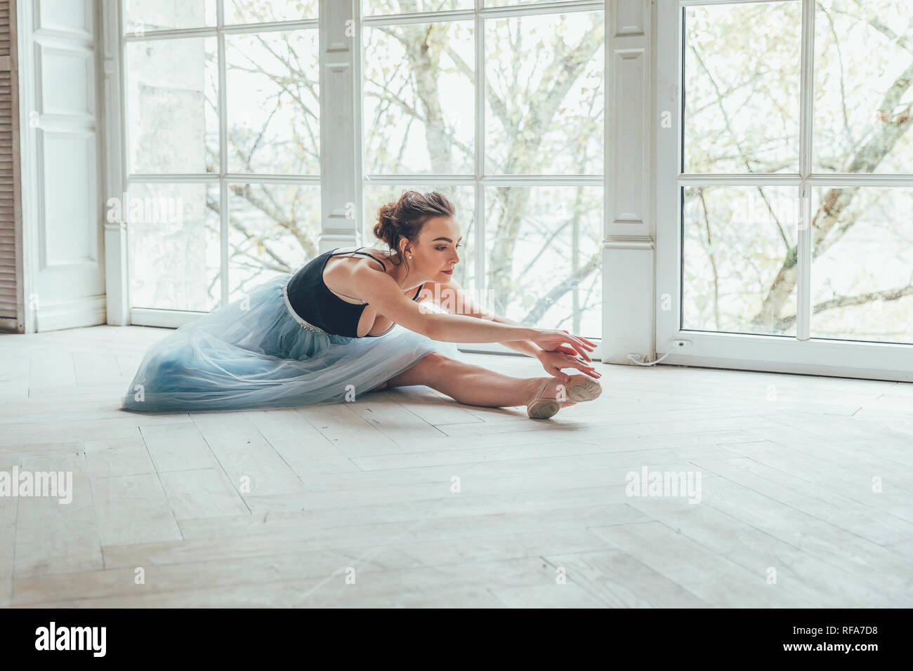 Young classical ballet dancer woman in dance class. Beautiful graceful ...