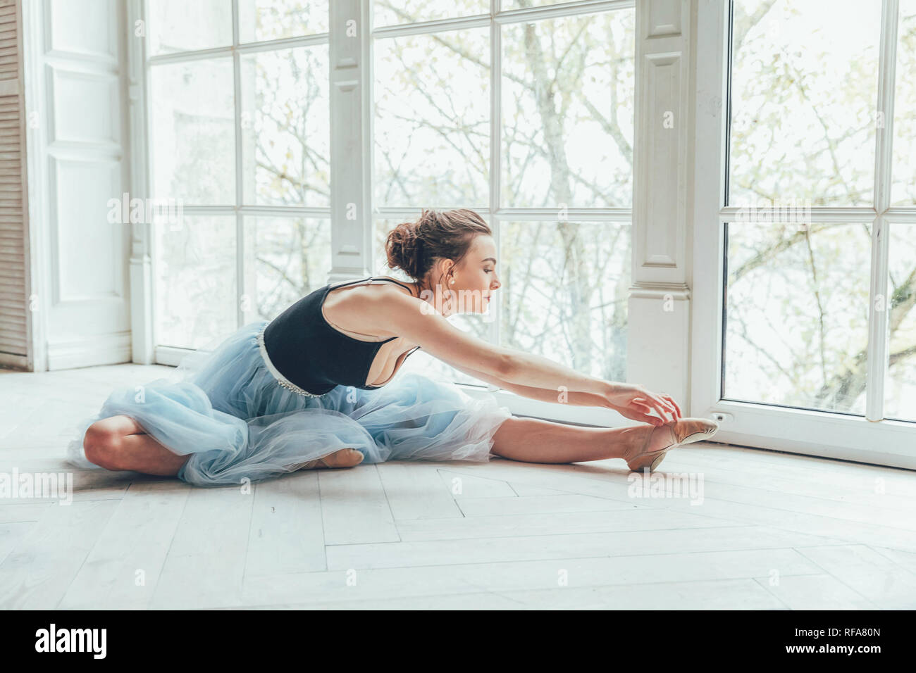 Young classical ballet dancer woman in dance class. Beautiful graceful ...