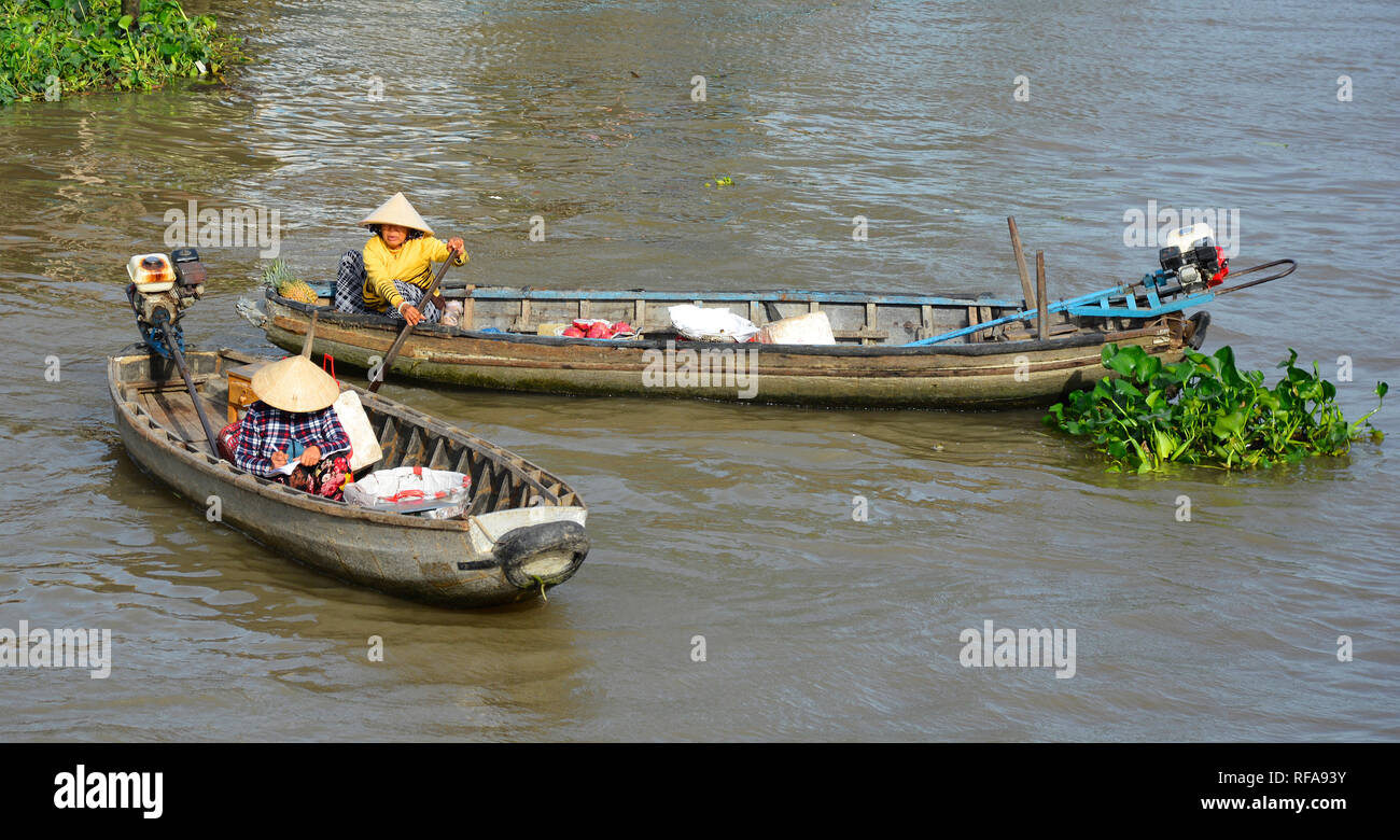 Phong Dien, Vietnam - December 31st 2017. Two market vendors in their ...