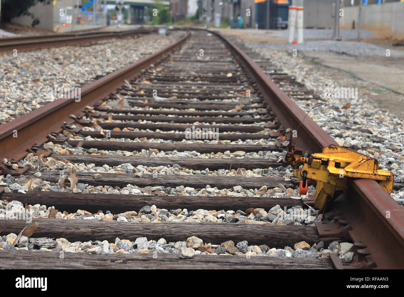 Railroad Train Tracks with track lock Stock Photo - Alamy