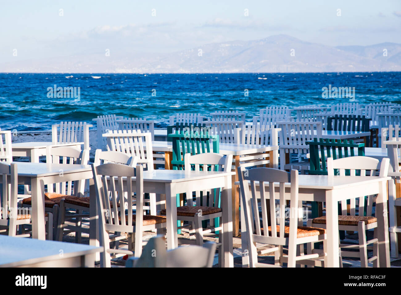 restaurant chairs and tables by the sea Stock Photo - Alamy