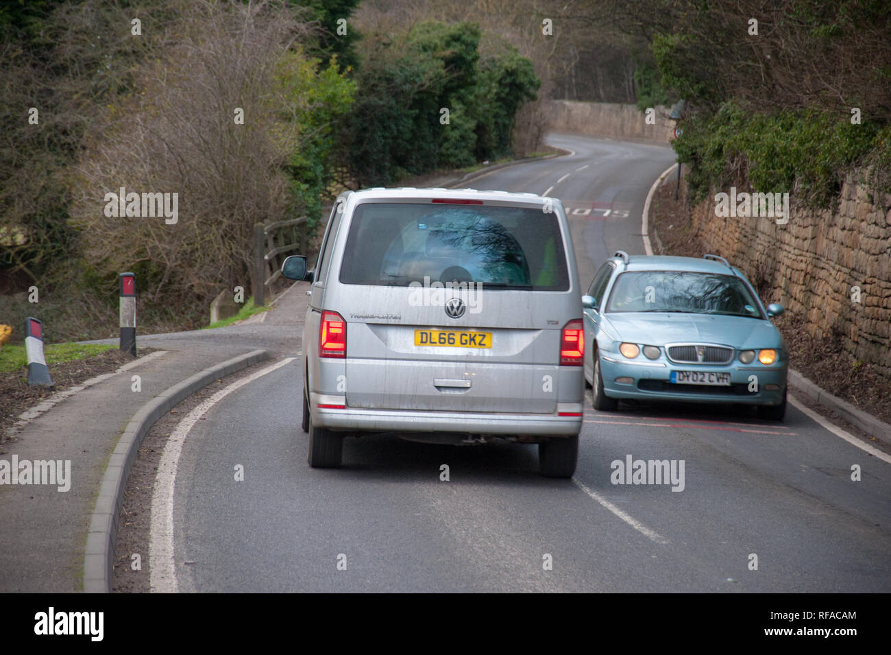 UK road scenes featuring a bus, lorry, and cars navigating winding ...