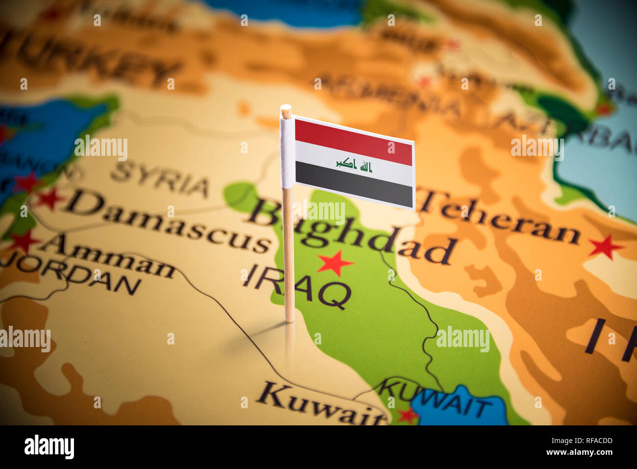 Iraqi marked with a flag on the map Stock Photo - Alamy