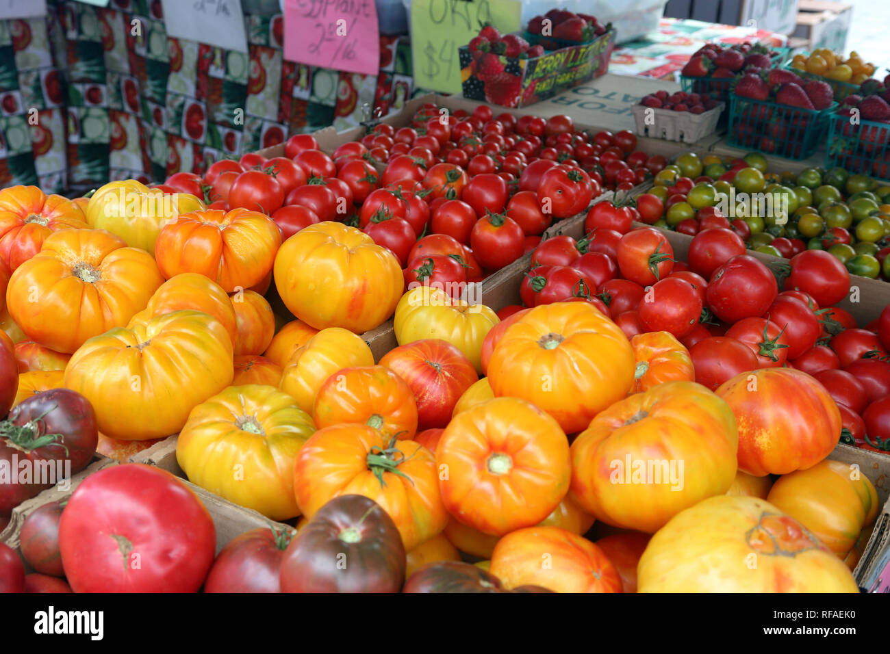 Fresh colorful tomotoes at open market Stock Photo - Alamy