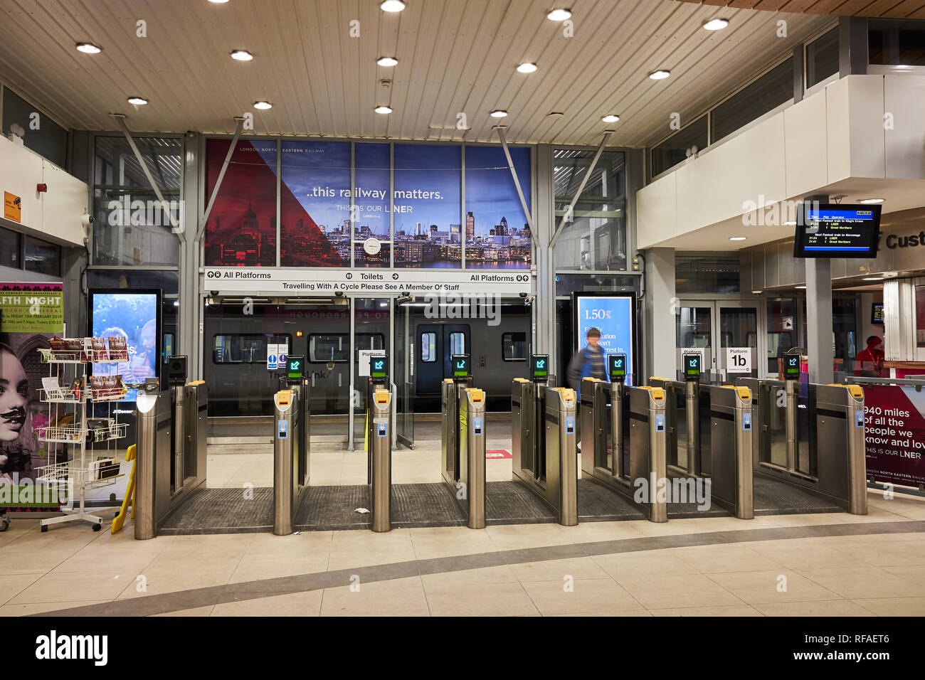 Ticket barrier and entrance to the platforms at the railway station of ...