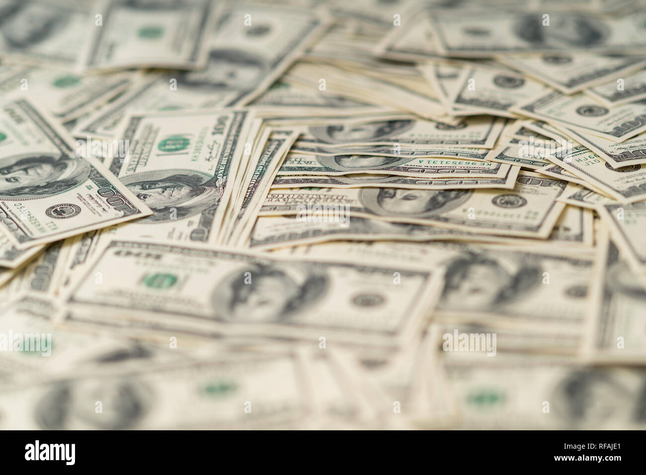 Background texture of multiple USD banknotes in an oblique angle ...