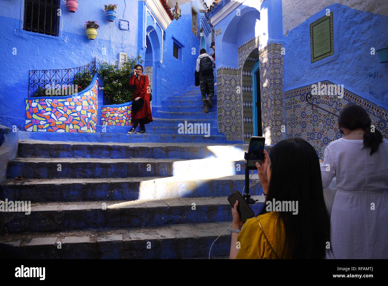 Tourists taking photographs in Chefchaouen, Morocco's Blue City Stock ...