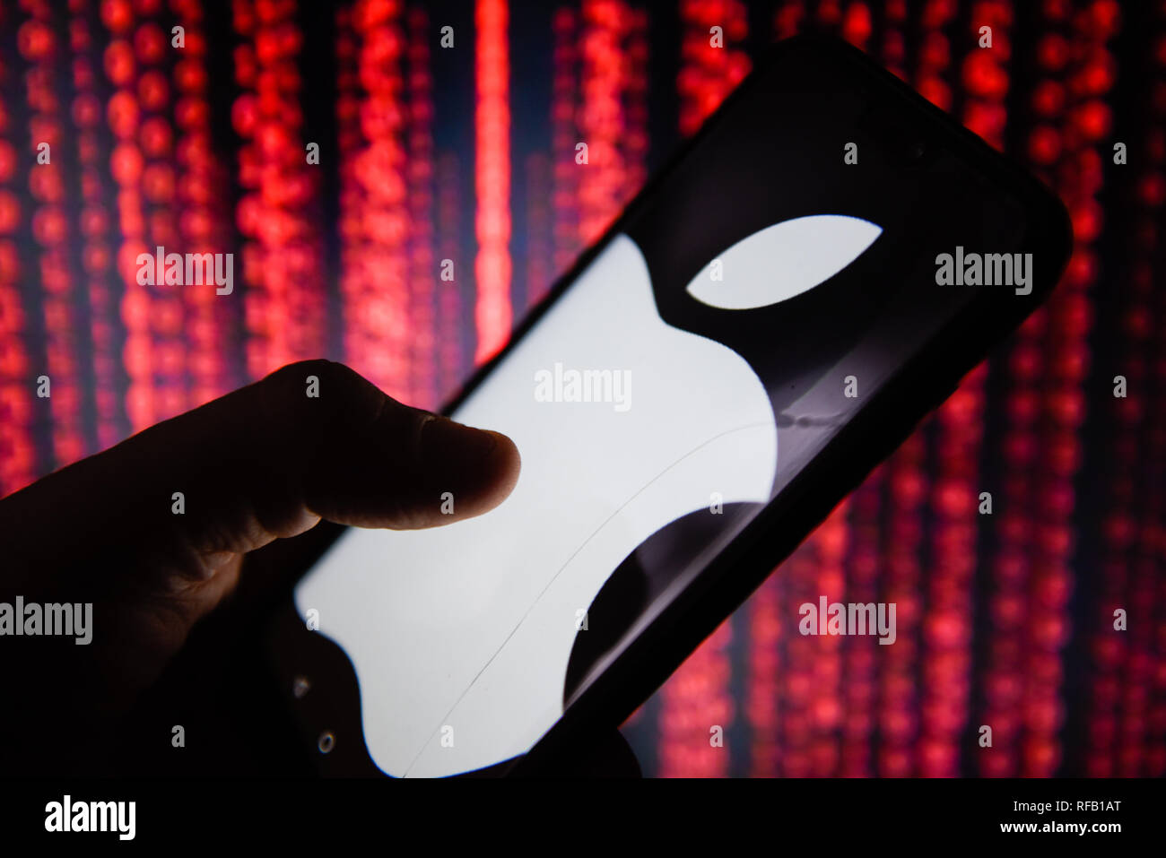 Apple logo is seen on a mobile phone Stock Photo - Alamy