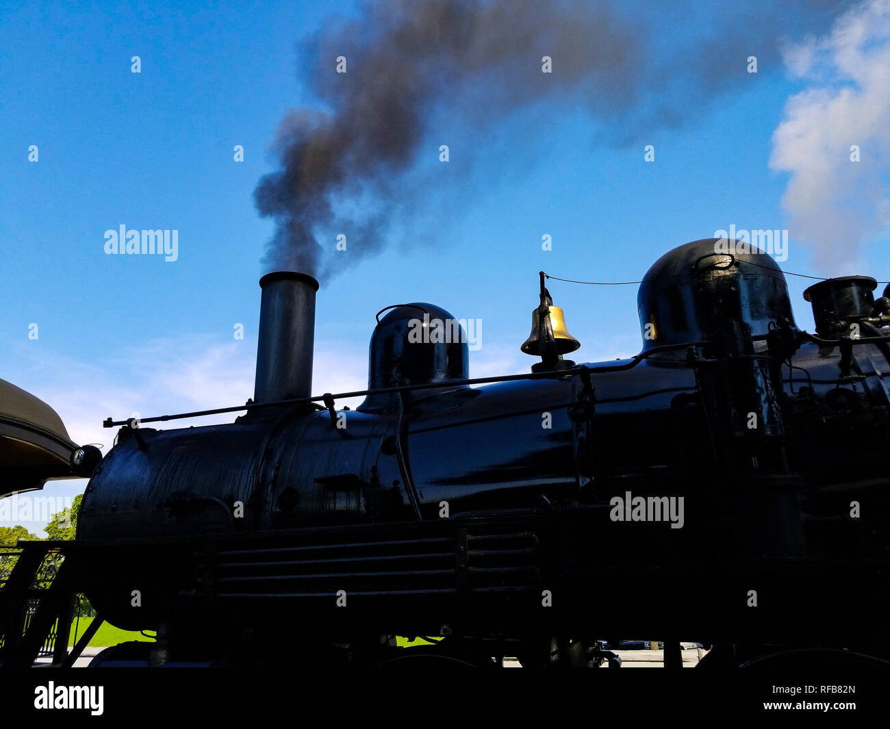 Steam Locomotive Warming up a Train Station on a summer Day Stock Photo ...