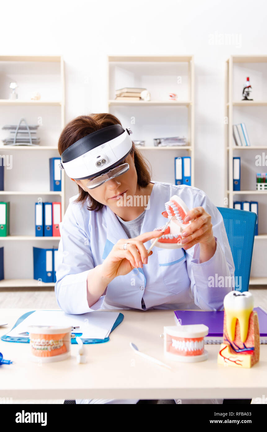 Female doctor working on new teeth implant Stock Photo - Alamy