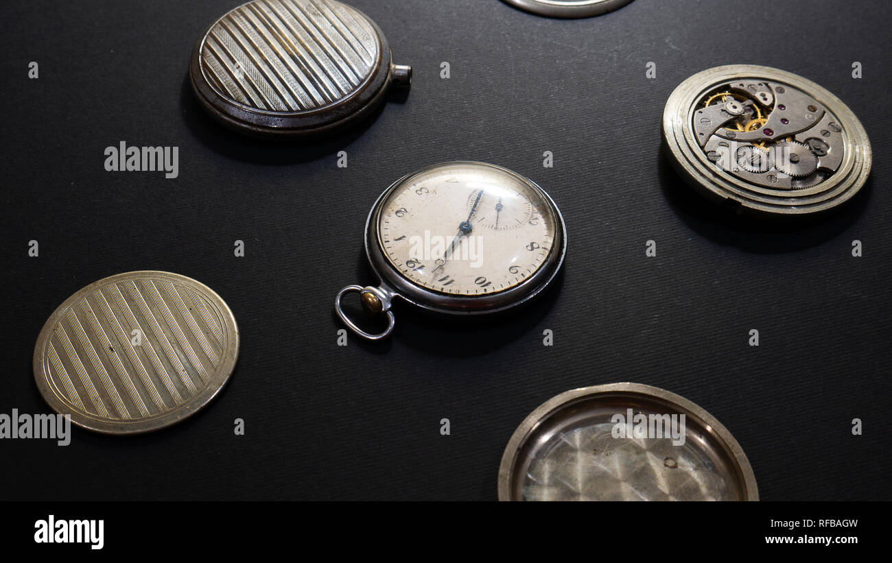 Mechanisms of watches and their parts on a black background Stock Photo ...