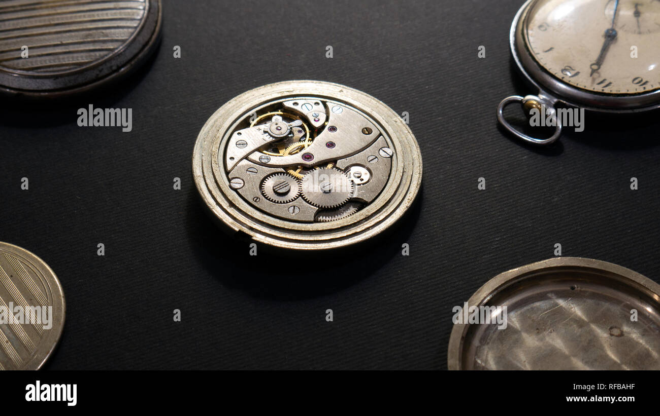 Mechanisms of watches and their parts on a black background Stock Photo ...