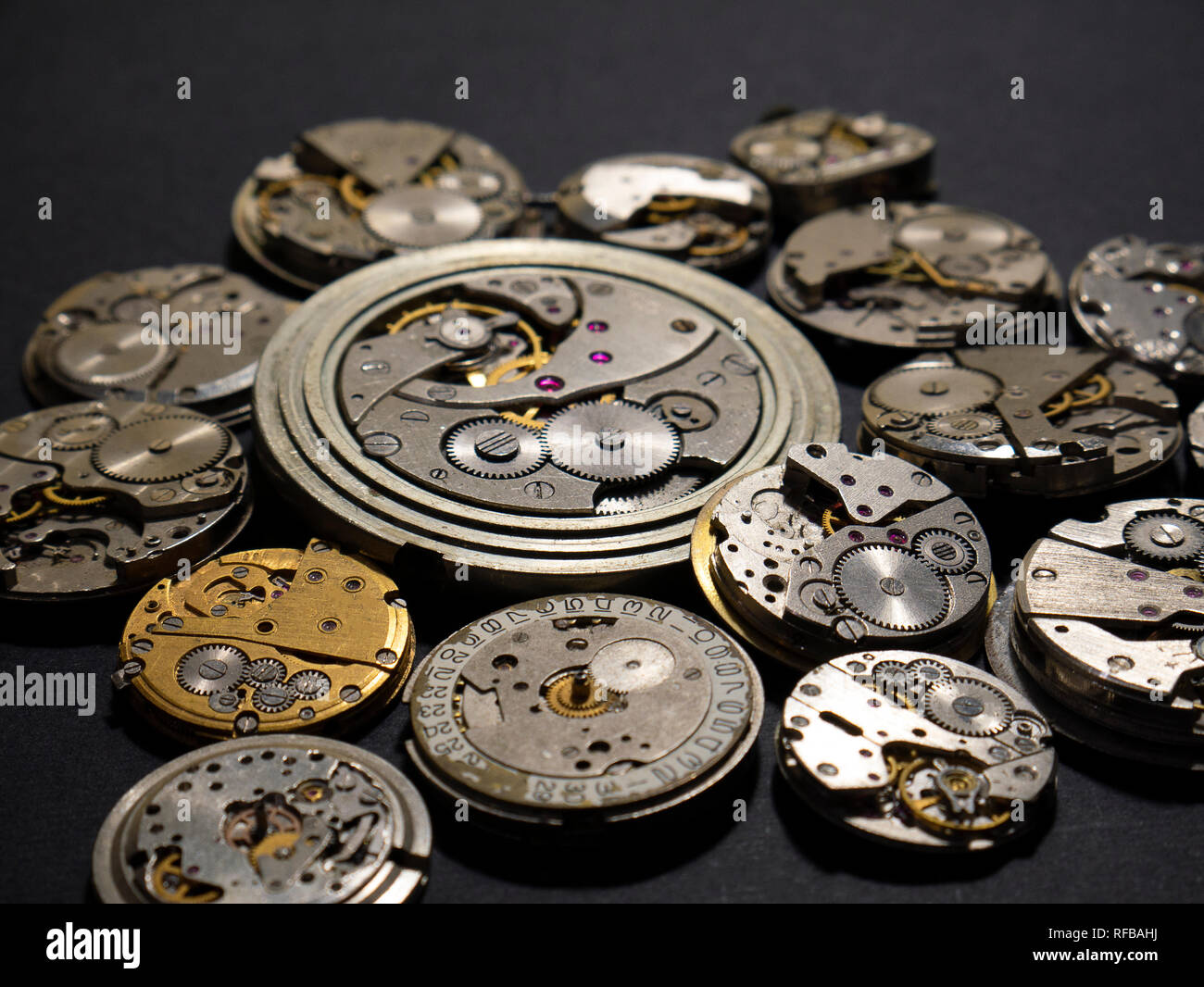 Mechanisms of watches and their parts on a black background Stock Photo ...