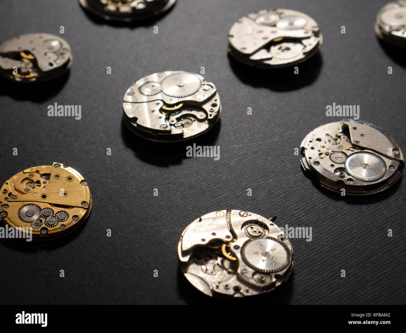 Mechanisms of watches and their parts on a black background Stock Photo ...