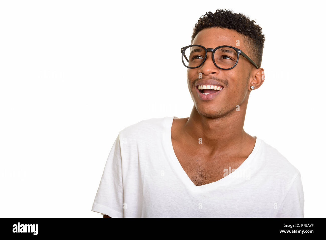 Young happy African man thinking and smiling Stock Photo - Alamy