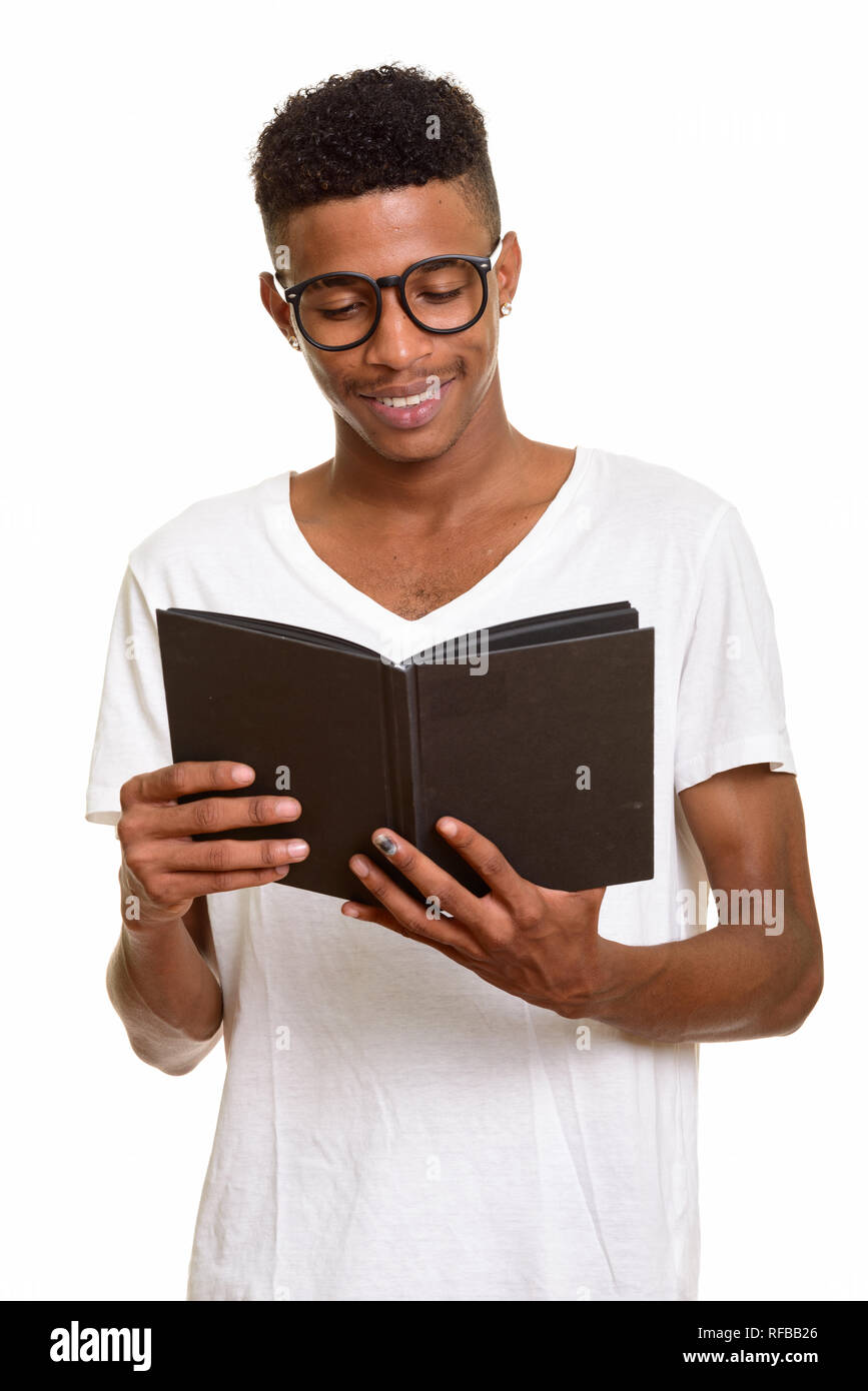 Young happy African man reading book isolated against white background ...