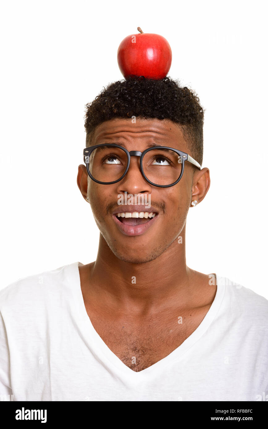 Young happy African man with apple on head Stock Photo - Alamy