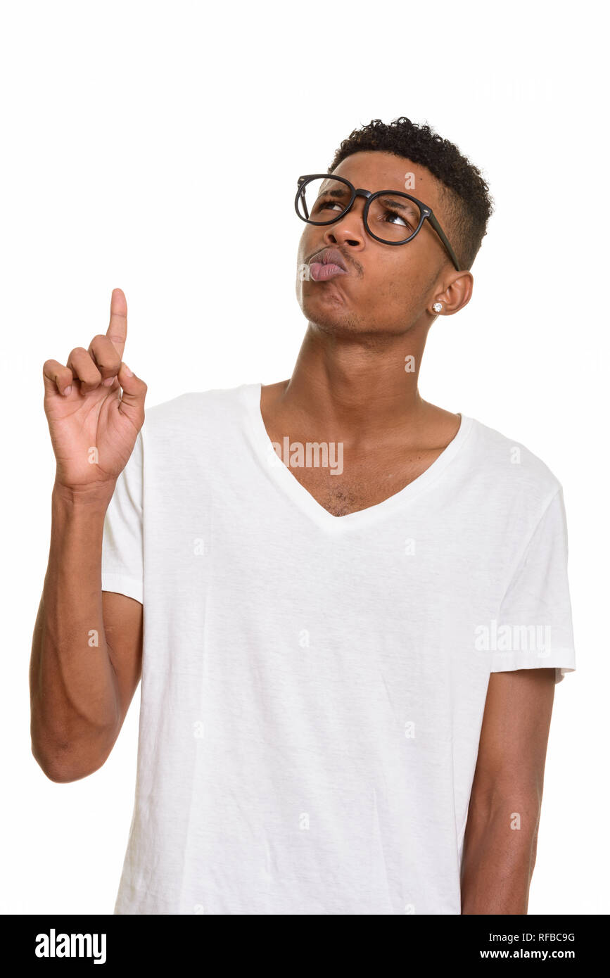 Young handsome African man thinking and pointing finger up Stock Photo ...