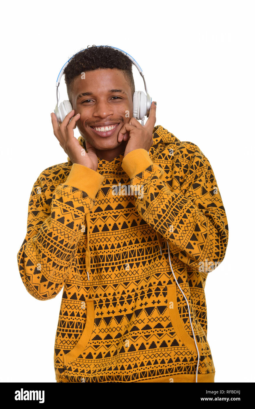 Young happy African man listening to music Stock Photo - Alamy