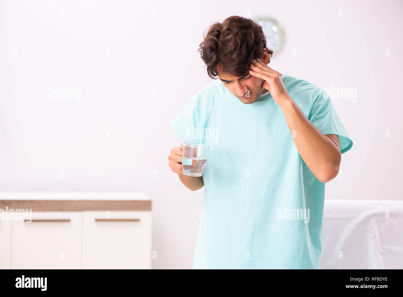 Young patient drinking water hospital hi-res stock photography and ...