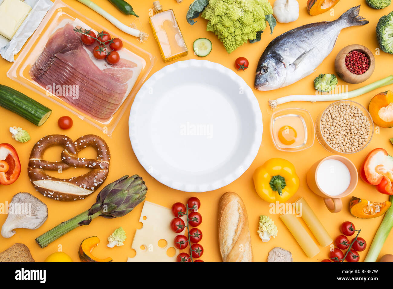 Food ingredients on yellow background Stock Photo - Alamy