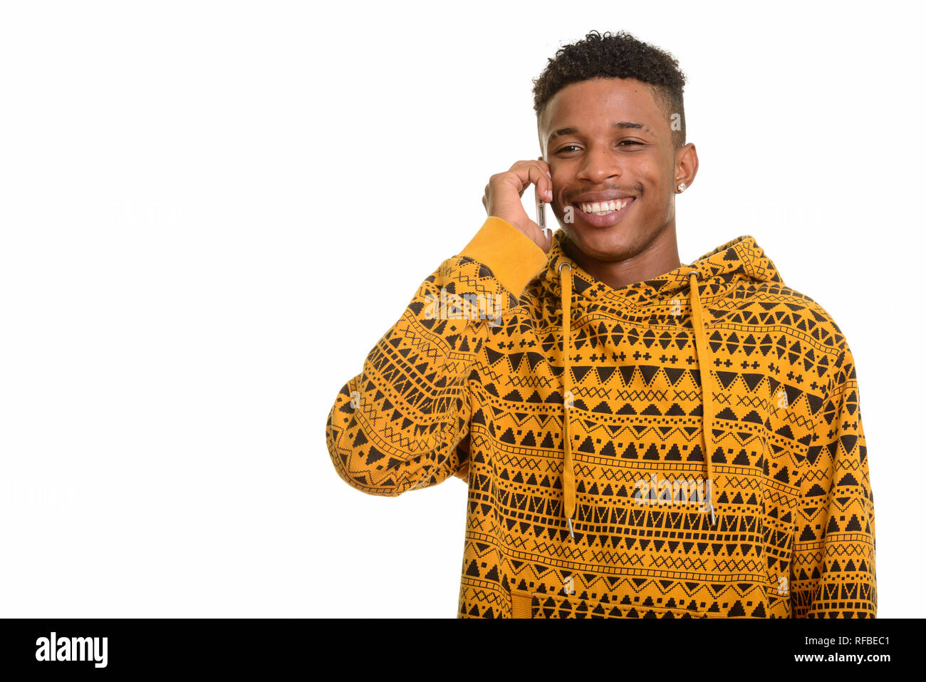 Young happy African man talking on mobile phone Stock Photo - Alamy