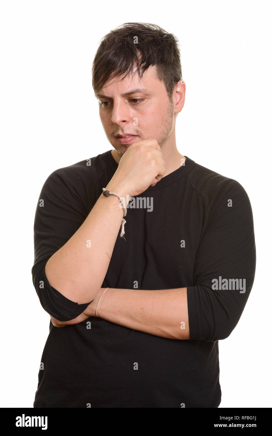 Studio shot of Caucasian man thinking isolated against white background ...
