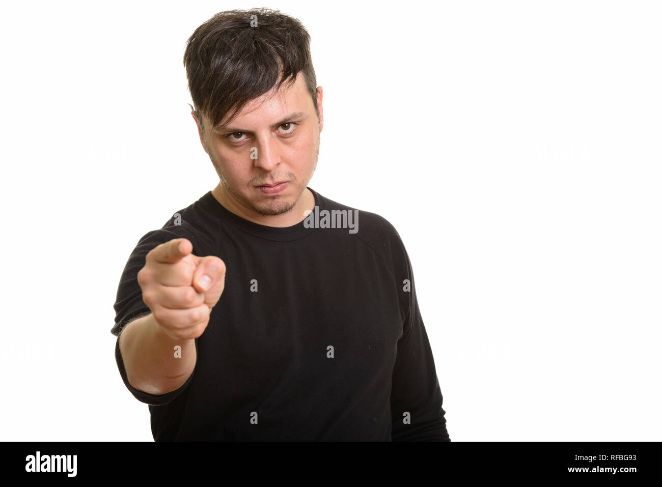 Studio shot of angry Caucasian man pointing finger at camera Stock ...