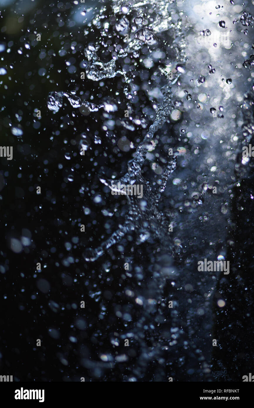 Water splashing at bottom of natural waterfall Stock Photo - Alamy