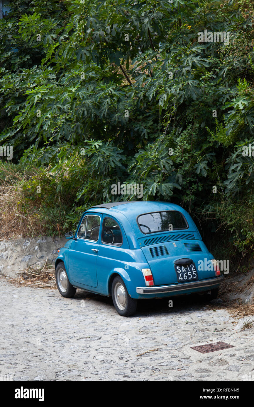 Fiat 500 parked on Italian track with trees in background Stock Photo ...