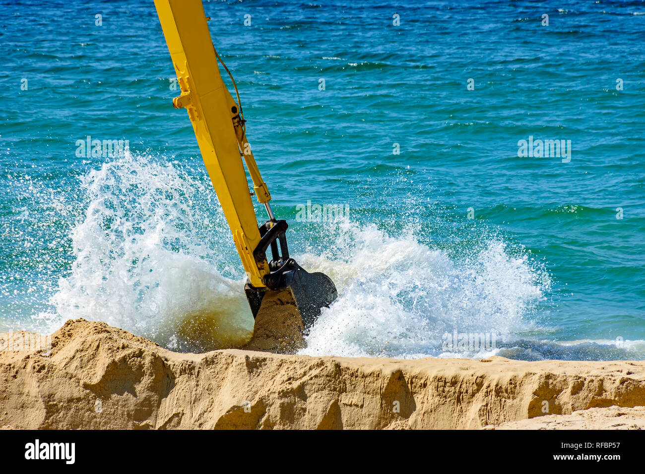 Backhoe removing sand from hi-res stock photography and images - Alamy