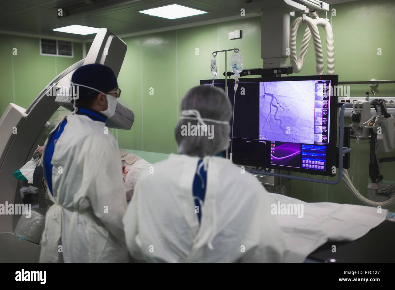 Doctors conduct a diagnostic operation. Coronarography. Percutaneous ...