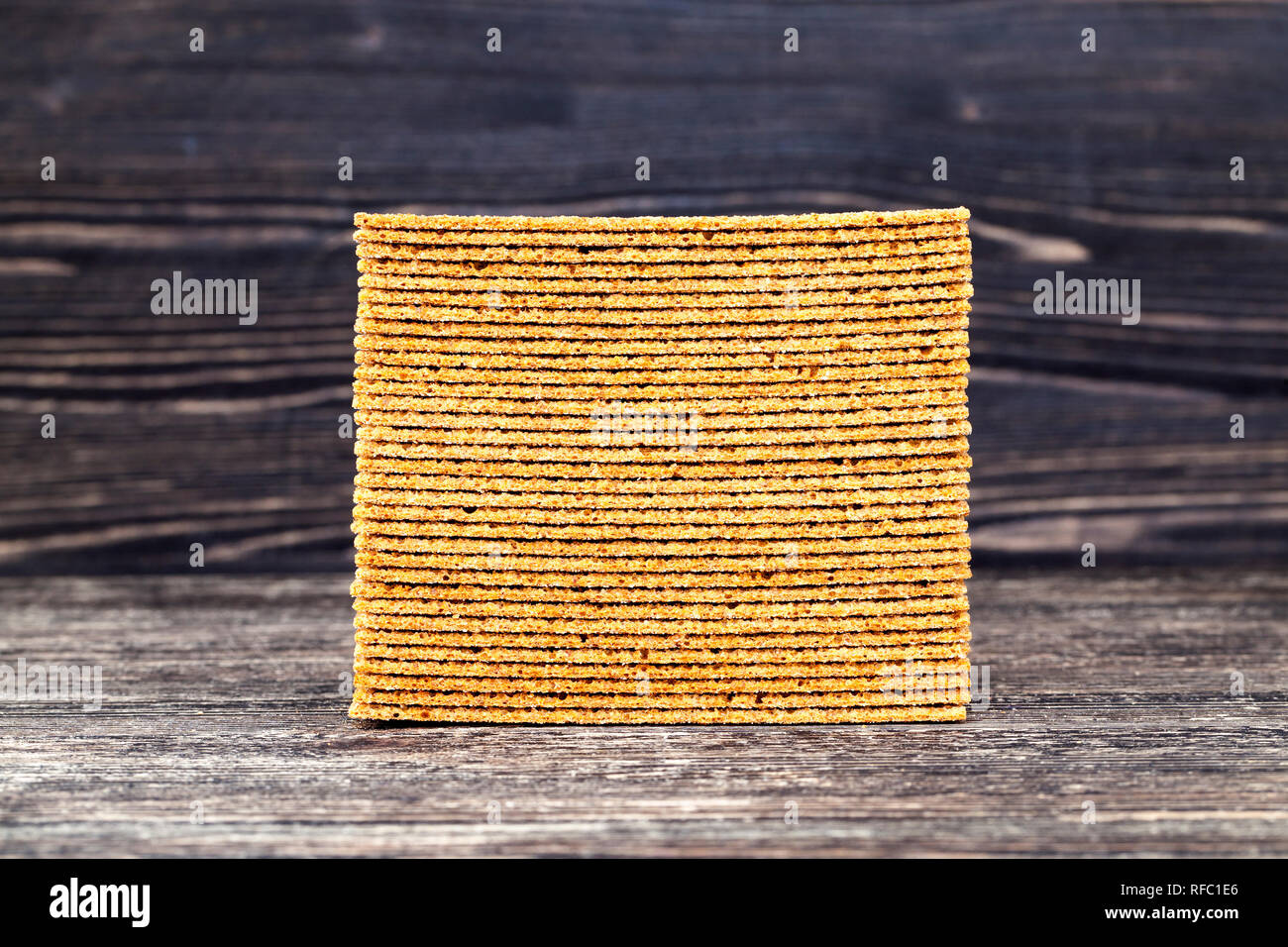 Rye long dry bread on a black wooden table, healthy dietary foods for ...