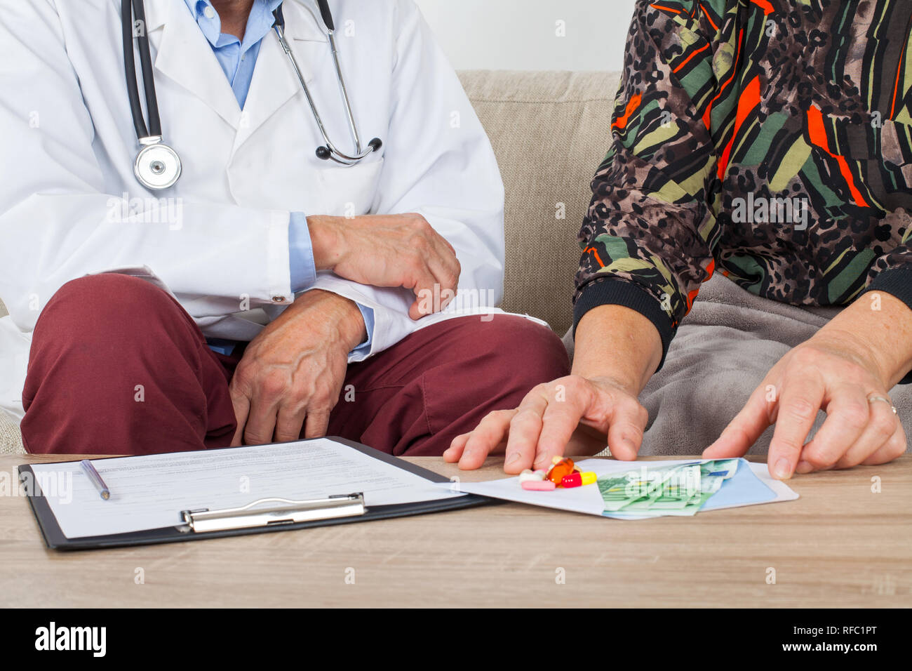 Close-up picture of a woman giving bribe money to a physician Stock ...