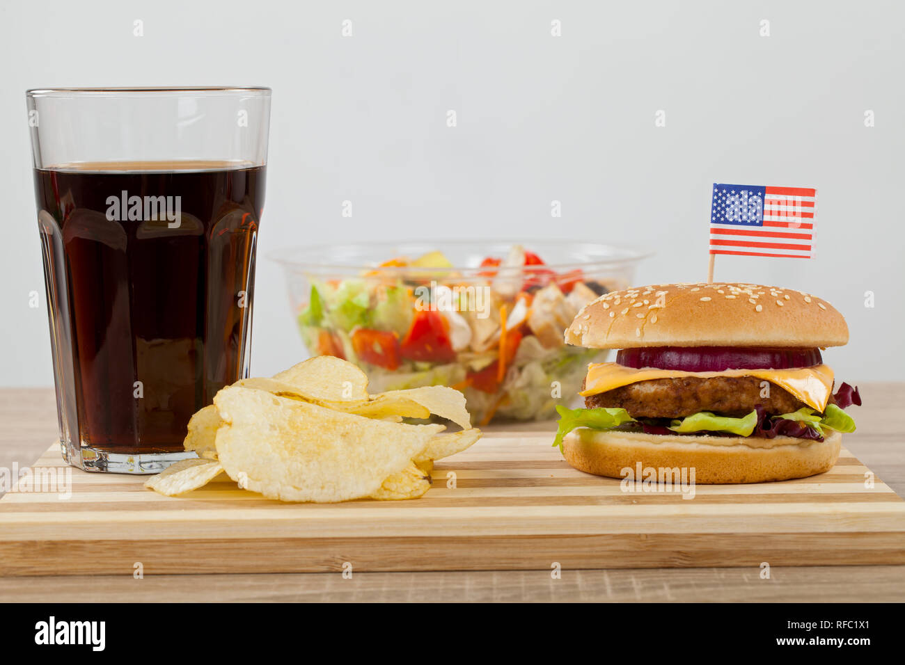 Delicious cheeseburger with beef, cheddar and lettuce, a side of potato ...