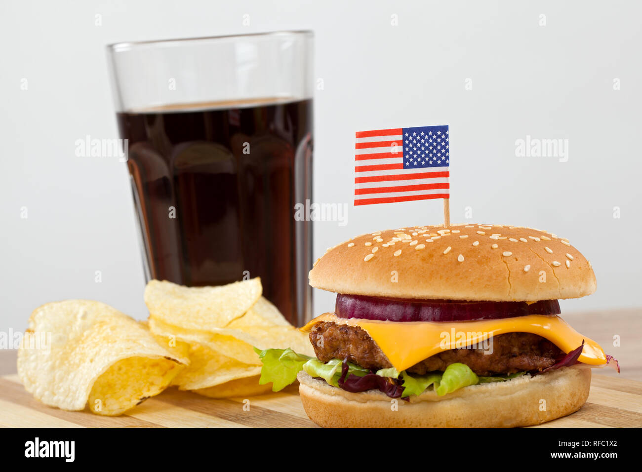 Delicious cheeseburger with beef, cheddar and lettuce, a side of potato ...