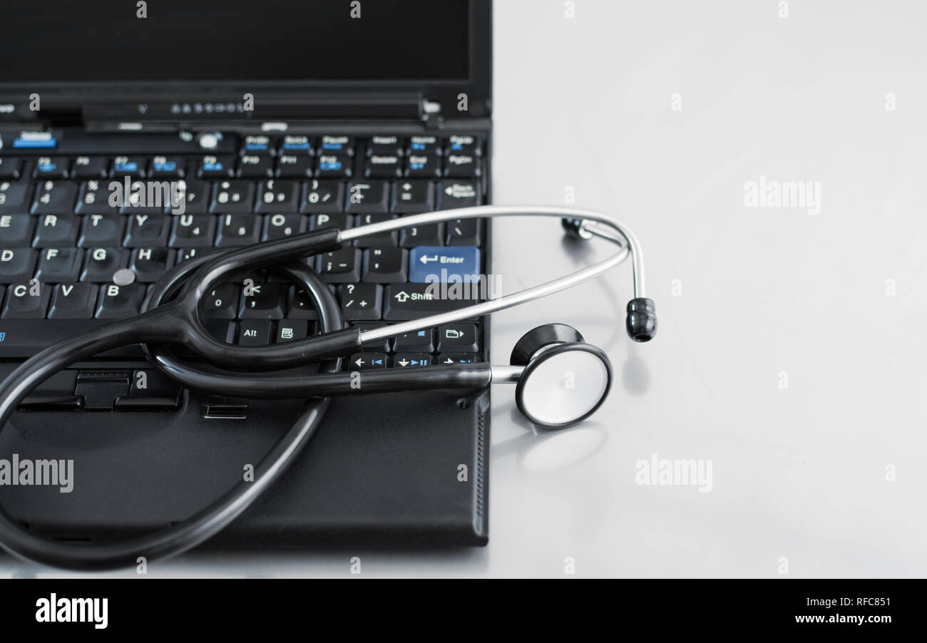 Electronic medical, stethoscope on PC/Laptop/Keyboard， blue toned ...