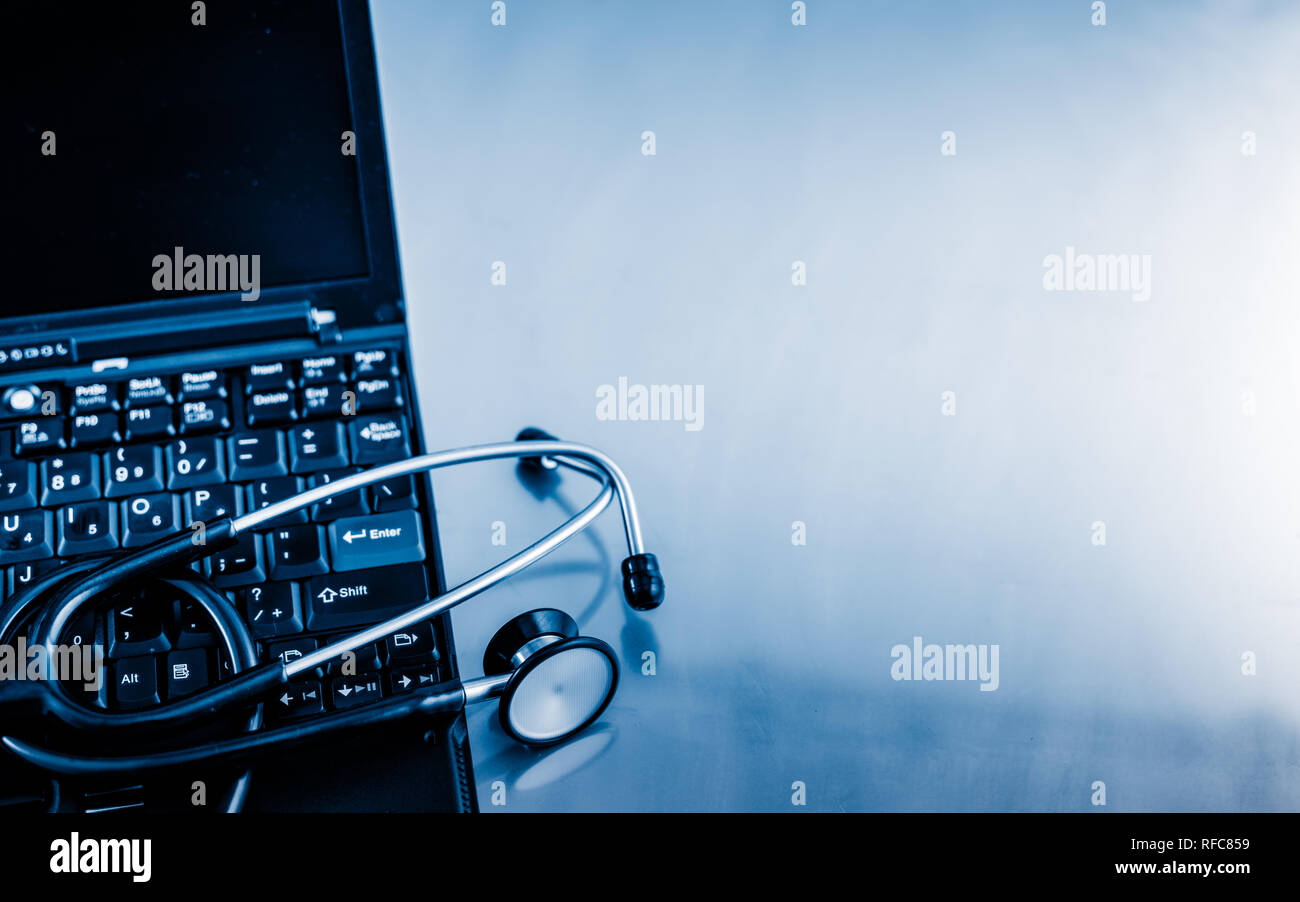 Electronic medical, stethoscope on PC/Laptop/Keyboard， blue toned ...