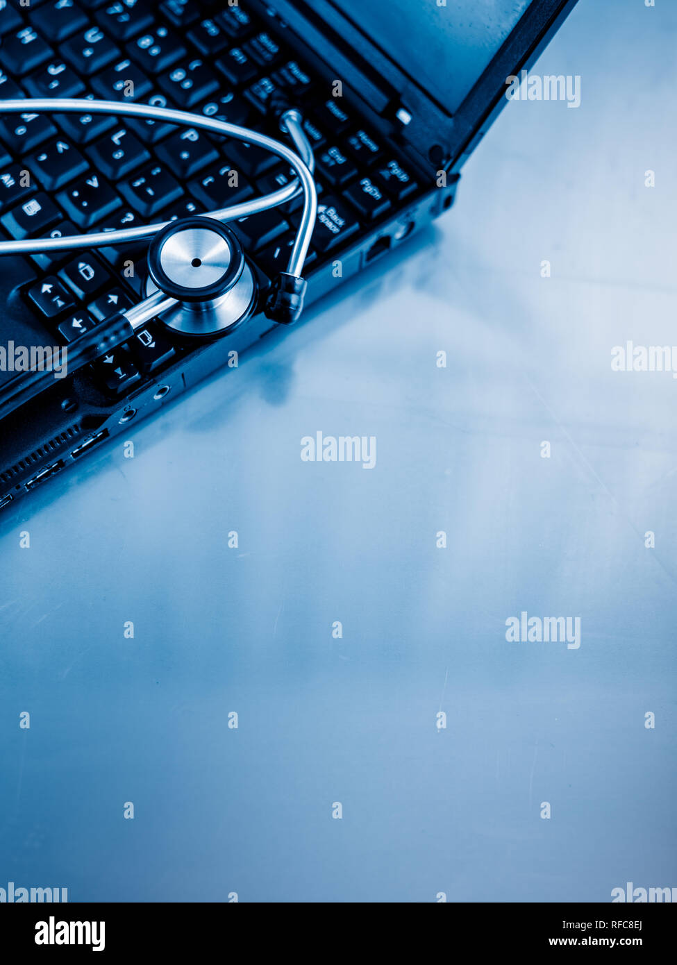 Electronic medical, stethoscope on PC/Laptop/Keyboard， blue toned ...